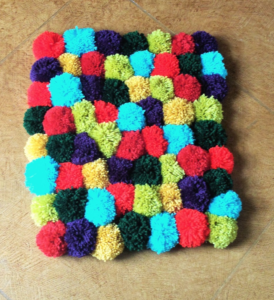 Make a Colorful Pom Pom Rug – Wonderful Creations